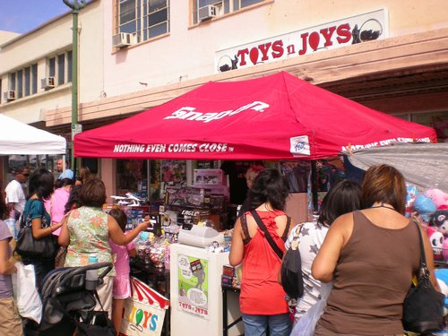 Huge crowds check out the Toys n Joys booth at the Celebrate Kaimuki Kanikapila!